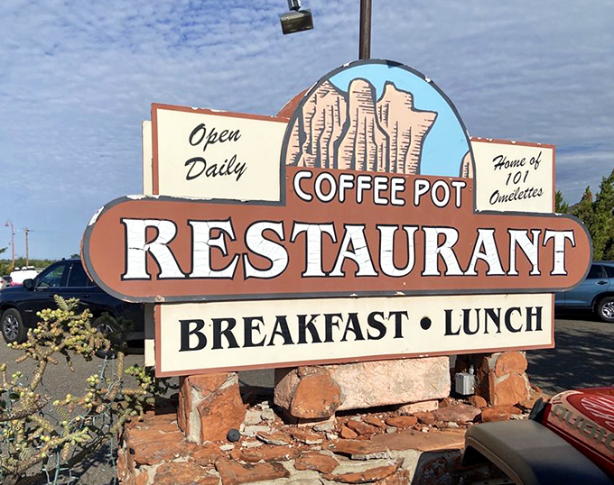 The roadside sign stands as a beacon of breakfast hope &ndash; a promise of "101 Omelets" that's been drawing hungry travelers for generations.