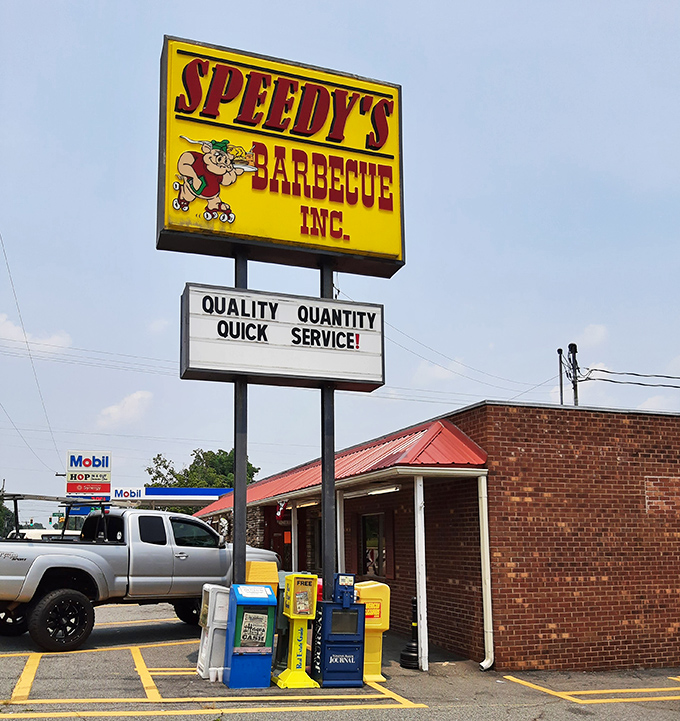 That yellow sign stands tall against the Carolina sky, a barbecue bat-signal summoning the faithful to gather for a feast of legendary proportions.
