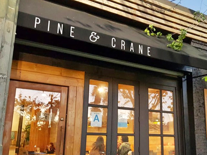 The warm glow through those windows at golden hour makes Pine & Crane look absolutely irresistible.