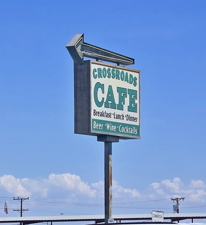 The roadside sign stands tall against Arizona's impossibly blue sky, a beacon of hope for hungry travelers seeking refuge from chain restaurant mediocrity.