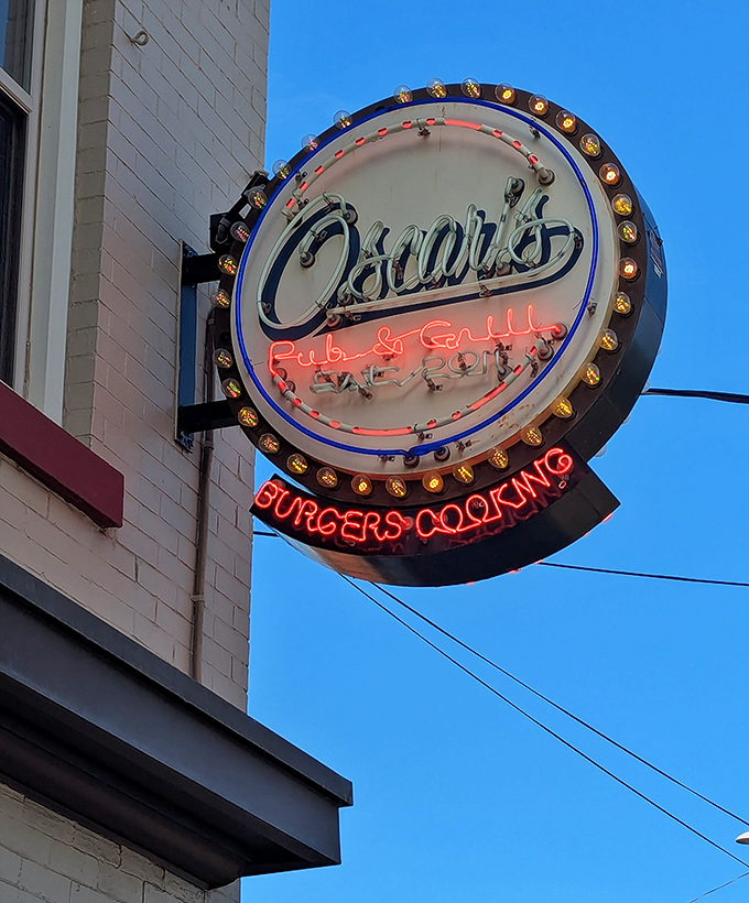 That neon sign doesn't just advertise&mdash;it beckons like a lighthouse for the hungry, a glowing promise of "BURGERS COOKING" that feels like coming home.