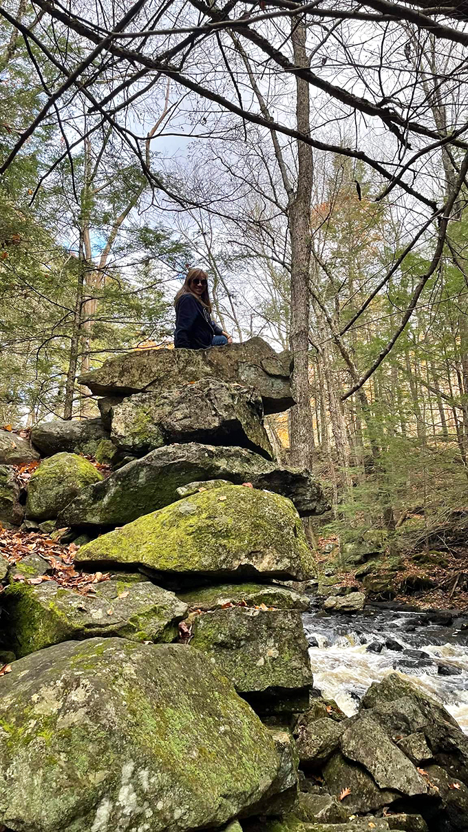 Nature's ultimate rock stack challenge! These massive boulders create perfect perches for contemplating the rushing stream below.