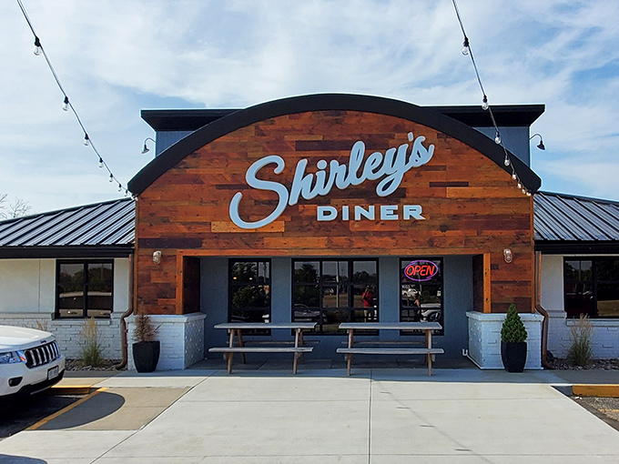 The wooden-clad storefront with its curved roofline promises what every great diner should: a place that feels like coming home.