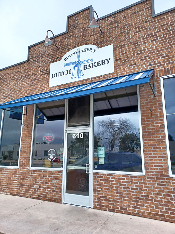 The blue awning and windmill sign serve as a beacon for carb-seeking pilgrims. This doorway leads to buttery bliss.