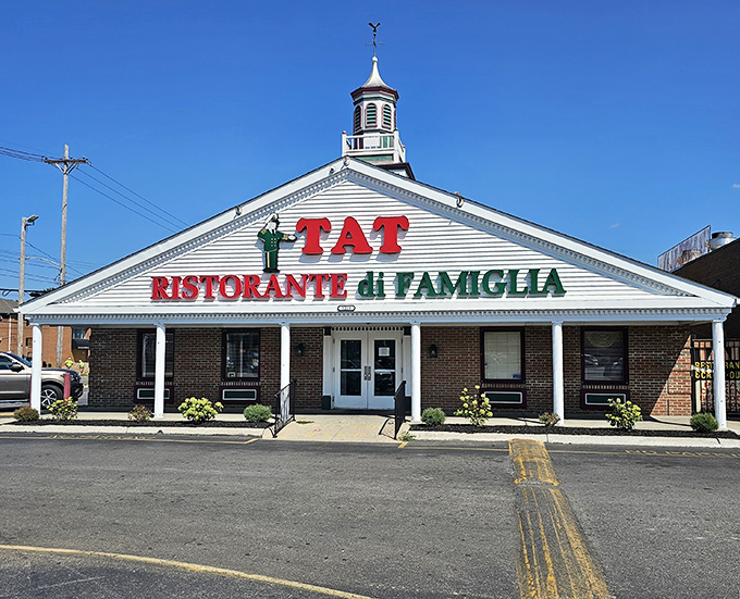 In daylight, TAT's distinctive storefront stands as a landmark to generations of Columbus families who've celebrated life's moments inside.