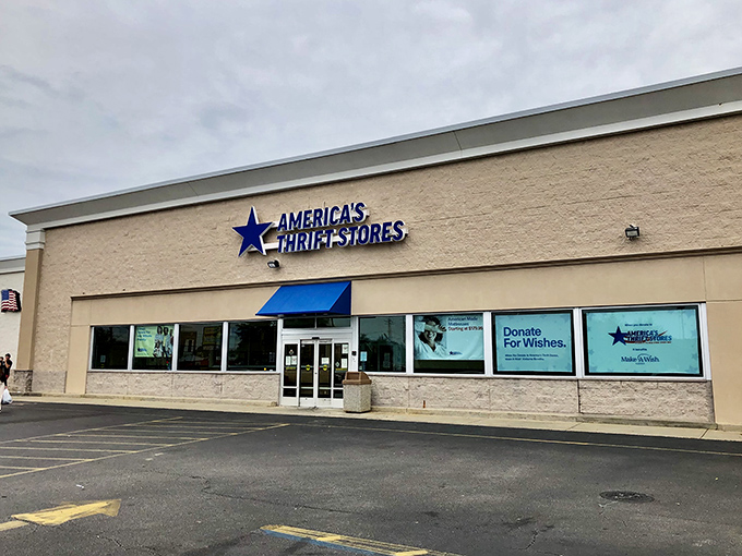 The blue awning beckons like a retail oasis in the Alabama heat. Your wallet's happy place awaits behind these unassuming doors.