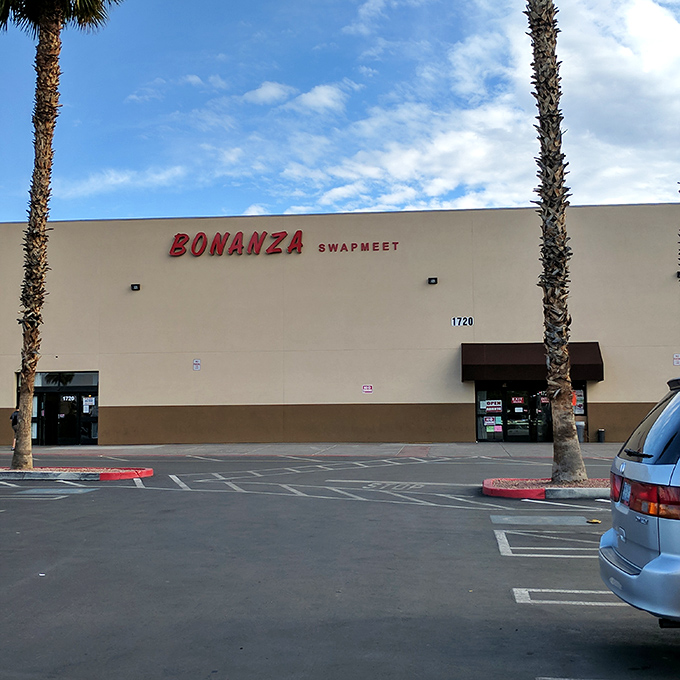 Palm trees stand guard outside Bonanza Swap Meet, a desert oasis of deals under the vast Nevada sky.