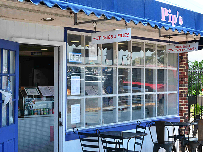 Pip's storefront promises exactly what it delivers: hot dogs, fries, burgers, and cheesesteaks&mdash;no pretense, just deliciousness waiting behind those blue-trimmed windows.