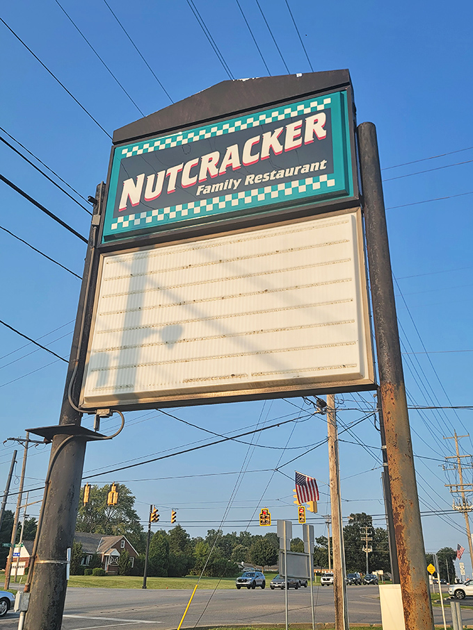 The roadside sign stands as a beacon of hope for hungry travelers. No fancy digital displays or trendy fonts&mdash;just the promise of honest food waiting inside.