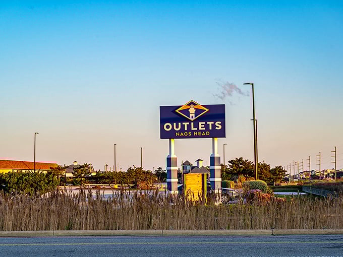 That distinctive Outlets Nags Head sign stands tall against coastal skies, beckoning shoppers from miles around toward savings.