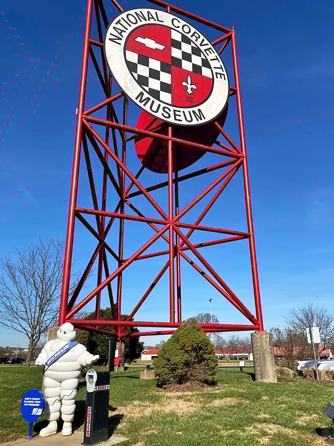 The iconic Corvette Museum sign towers above the Kentucky landscape, with the Michelin Man standing guard below. A beacon for gearheads everywhere.