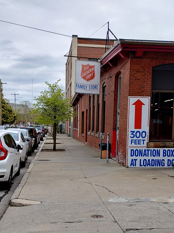 The sidewalk view showcases the store's convenient downtown location. That red arrow points the way to budget-friendly retail therapy.