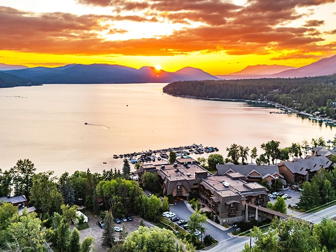 A Whitefish Lake sunset paints the sky in colors so vivid you'll wonder if Mother Nature hired a Hollywood lighting director.