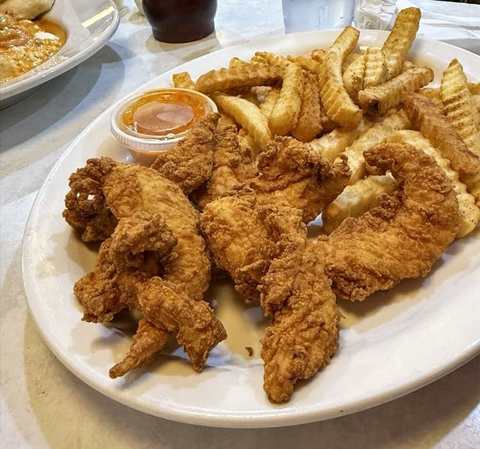 Golden-fried chicken tenders and crinkle-cut fries&mdash;the comfort food equivalent of a warm hug from your favorite aunt who never judges your life choices.