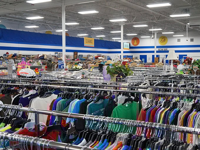 A rainbow of t-shirts stretches to the horizon – each one a cotton billboard for someone else's vacation, alma mater, or life philosophy.