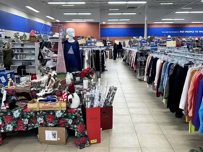 Seasonal displays that change like Connecticut weather. The mannequin stands guard over holiday treasures while shoppers hunt through the clothing forest.
