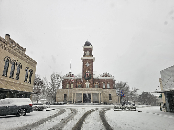 Snow transforms the courthouse square into a Southern winter wonderland, proving that even in Alabama, Jack Frost occasionally drops by for a surprise visit.