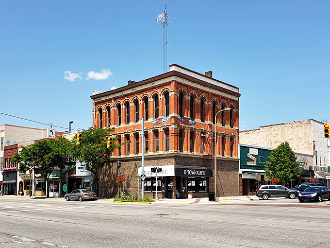 Owosso's corner landmark commands the intersection like a Victorian gentleman &ndash; complete with ornate "hat" and architectural swagger.
