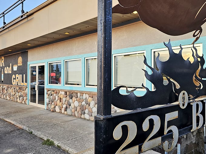 Stone foundations and glass doors - this Afton BBQ spot looks like it's been smoking secrets since forever.