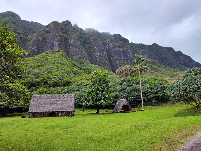 Ancient Hawaiian structures nestled beneath dramatic mountain peaks at Ahupuaʻa ʻO Kahana State Park. Like stepping into a living postcard of old Hawaii.