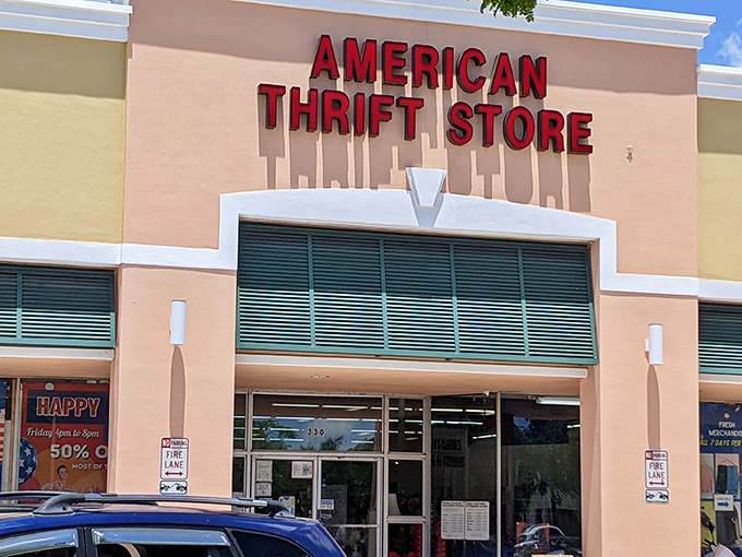 The bold red letters of American Thrift Store beckon like a lighthouse for bargain hunters. Treasure awaits inside!