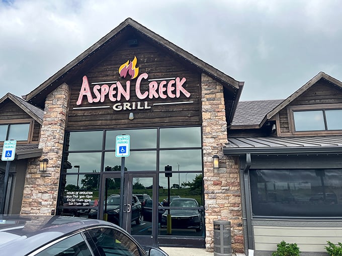 The rustic stone facade of Aspen Creek Grill promises what lies within&mdash;a carnivore's paradise where fancy meets friendly.
