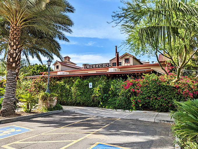 Bobby Q's garden-like entrance feels like discovering a secret barbecue oasis hiding behind palm trees and blooming bougainvillea.