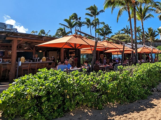Paradise served with a side of sunshine! Orange umbrellas dance above diners as waves provide the soundtrack to Roy's beachfront culinary magic.