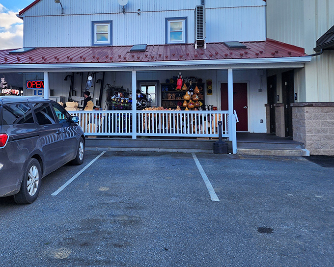 The unassuming white building with its welcoming porch promises sweet treasures inside. Like finding a dessert speakeasy in Amish country!