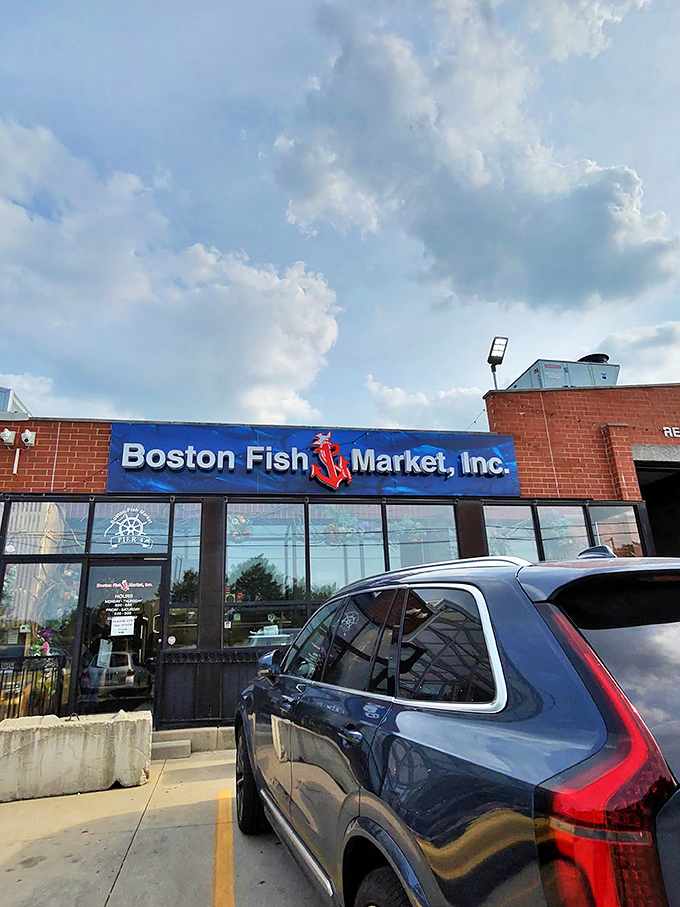Boston Fish Market's blue sign promises oceanic treasures. Like finding Atlantis in Des Plaines, but with better parking.