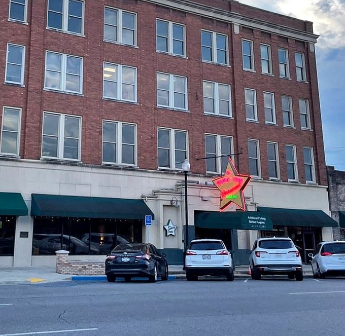 The iconic Bright Star Restaurant's neon sign glows like a beacon for hungry souls in downtown Bessemer.