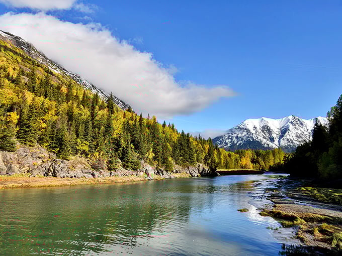 Autumn's golden touch transforms Chugach State Park into nature's masterpiece, where mountains meet reflections in a perfect Alaskan symphony.