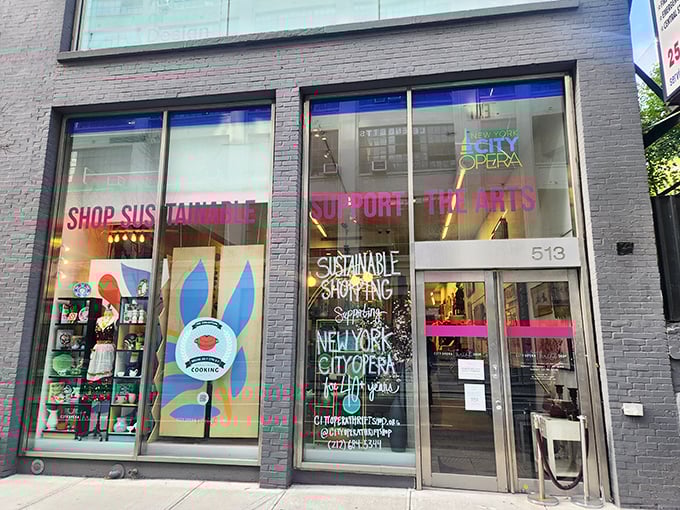 The City Opera Thrift Shop's sleek gray storefront promises sustainable shopping treasures while supporting the arts. Window-shopping here is already a cultural experience!