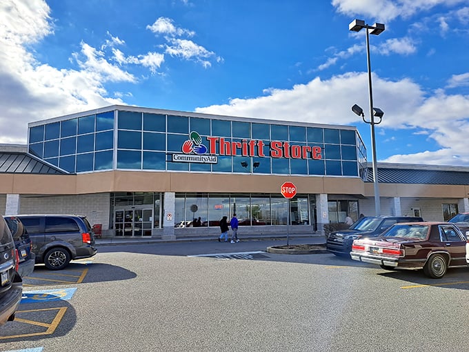 The gleaming glass facade of CommunityAid beckons like a cathedral of second-hand treasures. Bargain heaven awaits!