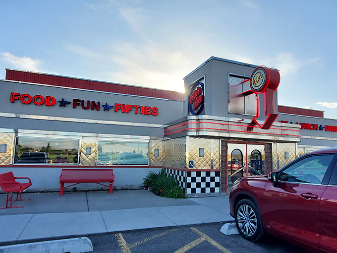 The classic 1950s facade of Dixie's Diner glows with retro charm. Food, fun, and fifties await inside!