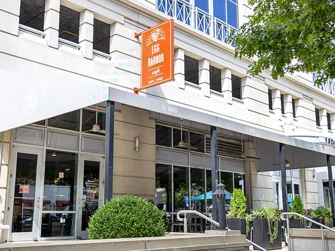 The bright orange sign of Egg Harbor Cafe promises morning delights in a setting that feels like sunshine even on cloudy days.
