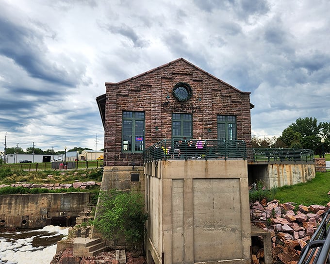 The historic Falls Overlook Cafe stands proudly by the rushing waters, a brick sentinel guarding breakfast treasures within.