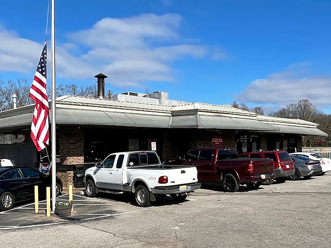 The humble exterior of Golden Rule Bar-B-Q, where that American flag promises patriotic levels of smoke and flavor.
