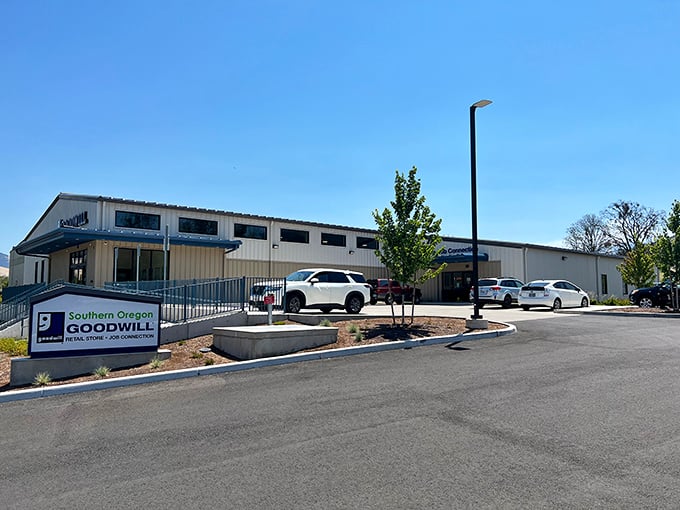 Thrift paradise awaits! Southern Oregon Goodwill's Ashland location shines like a beacon of bargain-hunting bliss under clear blue skies.