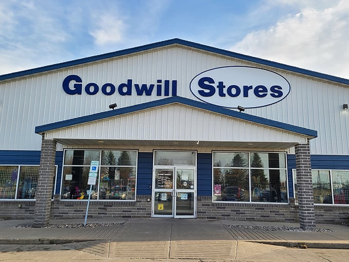 The blue-trimmed Goodwill storefront stands like a treasure chest waiting to be opened. Inside, bargain hunters find their happy place.