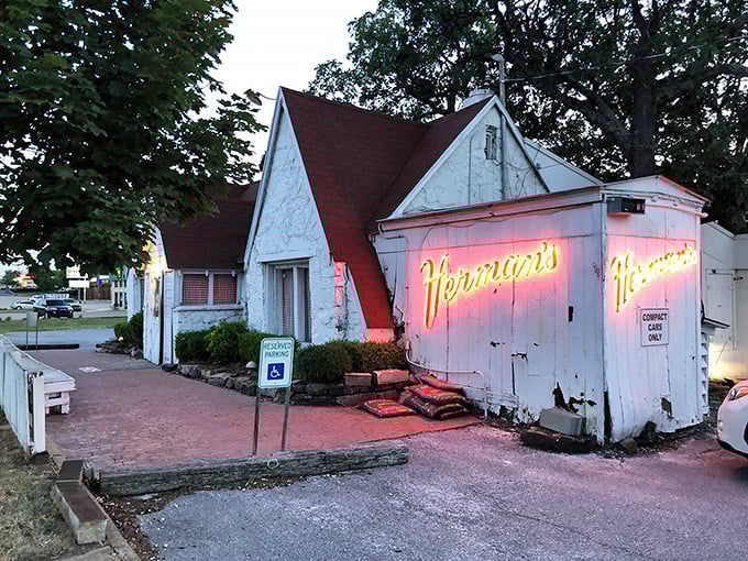 Herman's glowing neon sign beckons hungry travelers like a lighthouse for steak lovers. This unassuming spot holds treasures within.