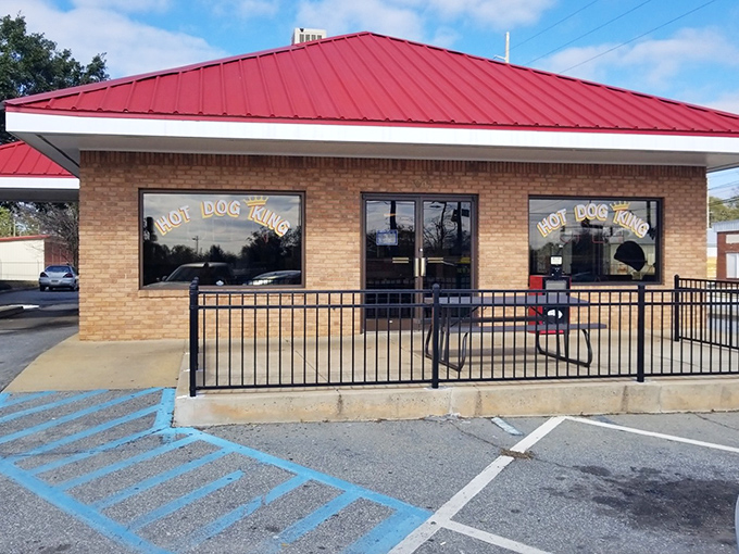 Hot Dog King's brick building with its cherry-red roof stands like a beacon of hope for hungry travelers in Albany.