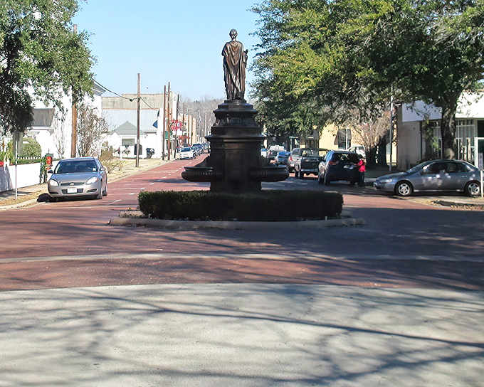 Jefferson's historic downtown welcomes visitors with a stately statue and brick streets. Like stepping into a Texas-sized time capsule!
