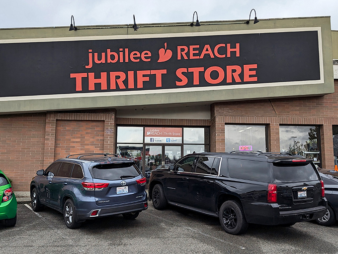 The Jubilee REACH storefront stands like a bargain beacon with its bold red letters promising treasures within. Who needs retail therapy when thrift therapy is this inviting?