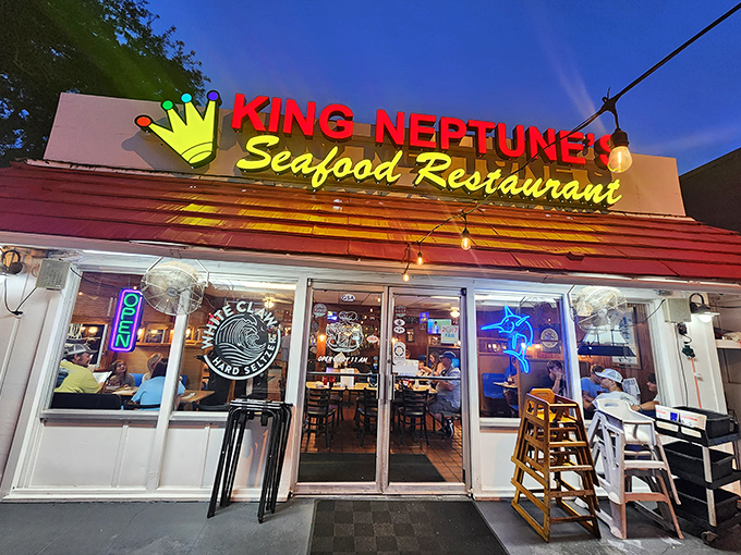 King Neptune's Seafood Restaurant glowing sign beckons seafood lovers like a lighthouse for hungry sailors. Royal treatment for your taste buds awaits inside!