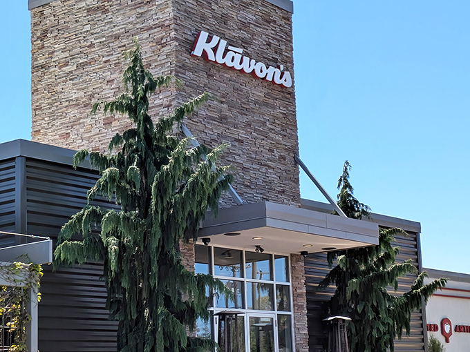 Klavon's stone tower stands tall like a pizza lighthouse, beckoning hungry travelers with promises of cheesy delights.