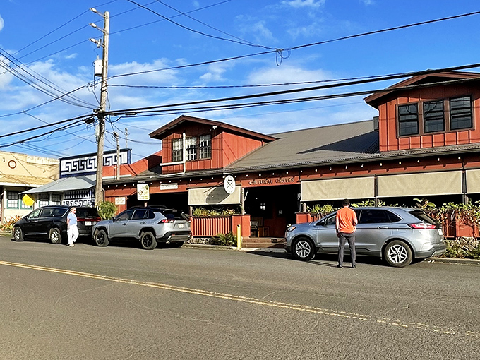 Historic red buildings of Old Kōloa Town welcome visitors with plantation-era charm and local shops.