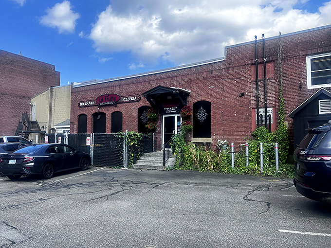 La Festa's brick exterior isn't just charming&mdash;it's a portal to pizza paradise hiding in plain sight on Dover's Central Avenue.