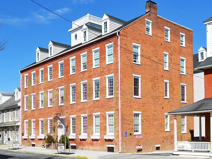 Historic brick buildings in Lititz stand as timeless sentinels, their windows like eyes watching centuries pass by.