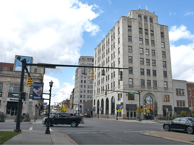 Downtown Mansfield rises like a vintage movie set, where classic architecture meets modern dreams of affordable living.